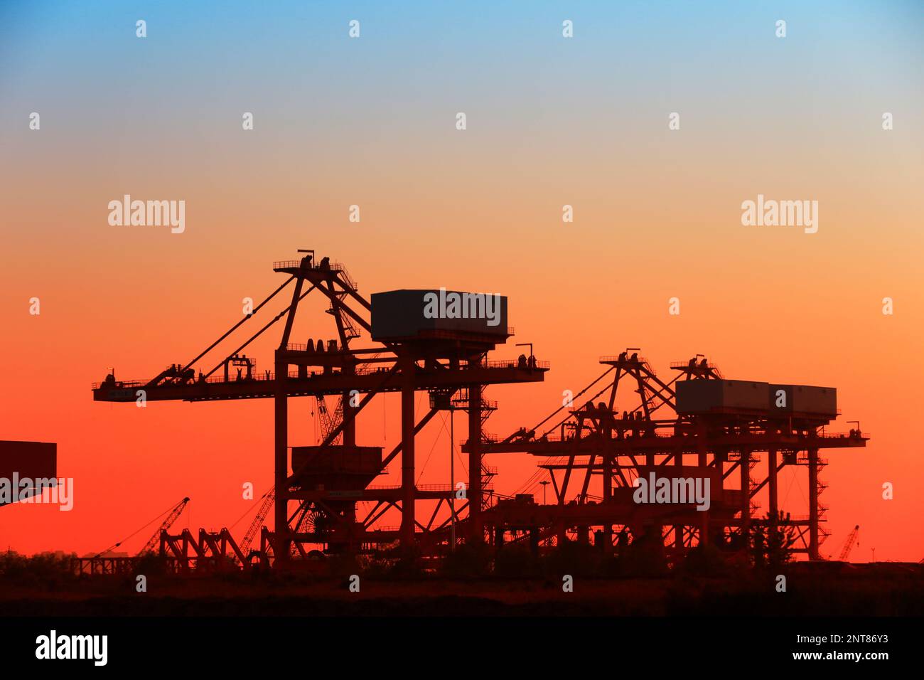 Port crane unloading container ships Stock Photo - Alamy