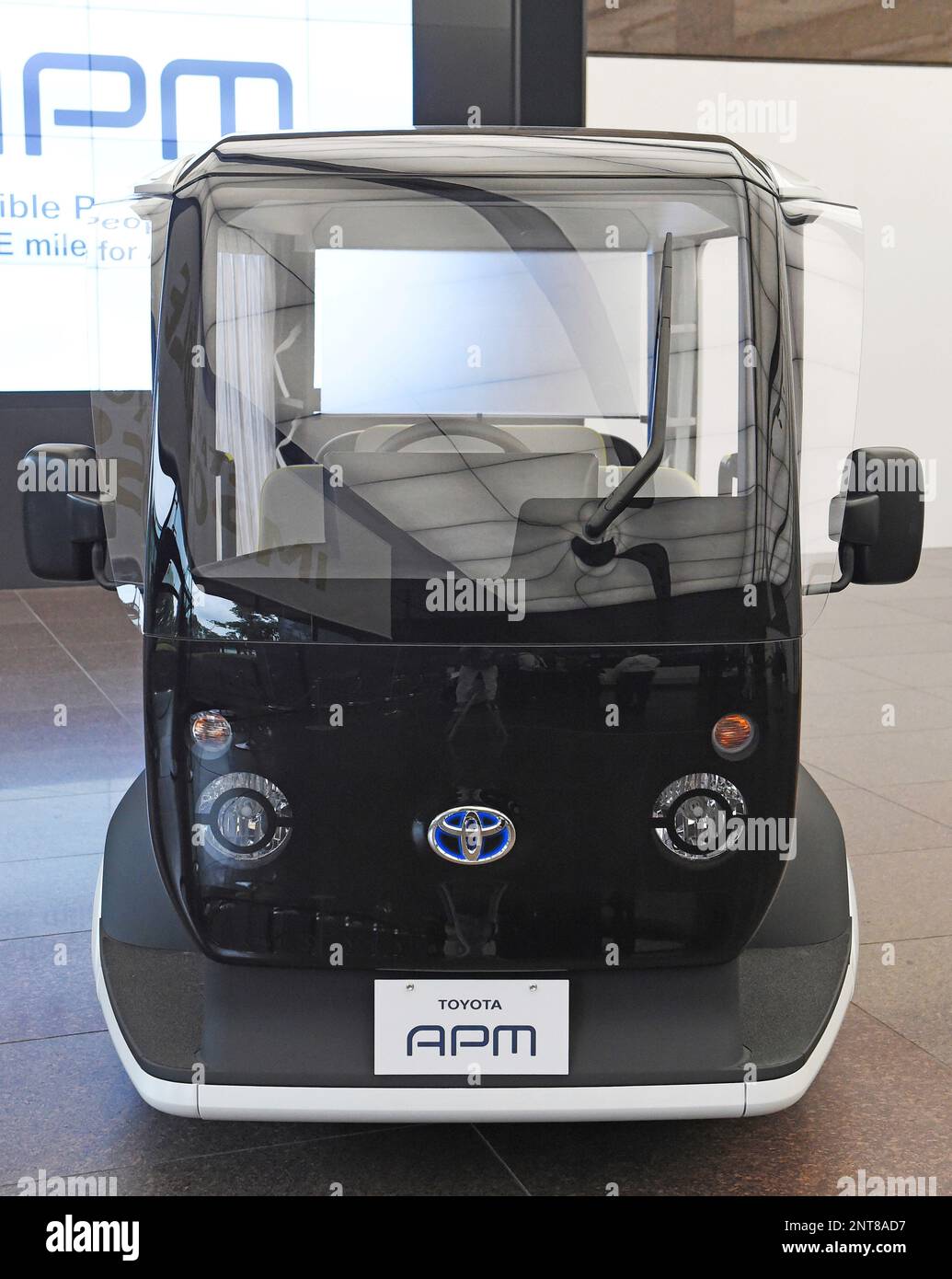 A photo shows a mobility "APM" developed by Toyota Motor Corporation ...