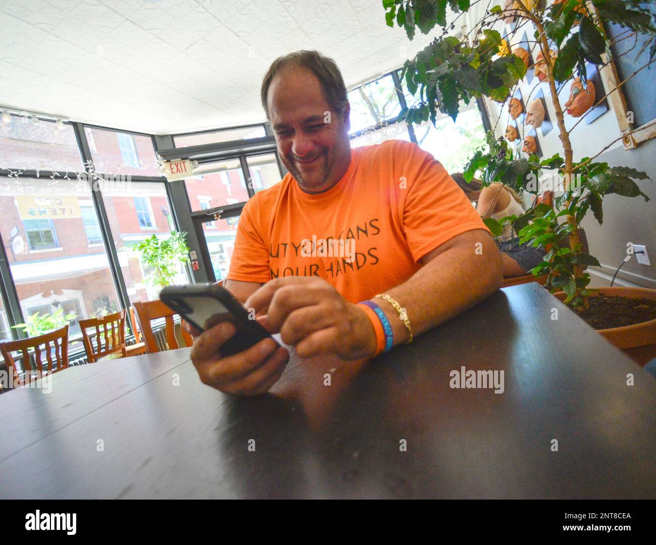 In a July 2, 2019 photo, Jim Ruggiero smiles as he looks at a photo of ...