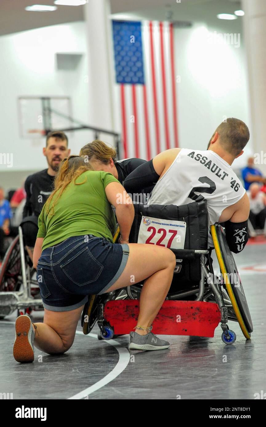 A player gets his wheel changed during the gold medal quad rugby game ...