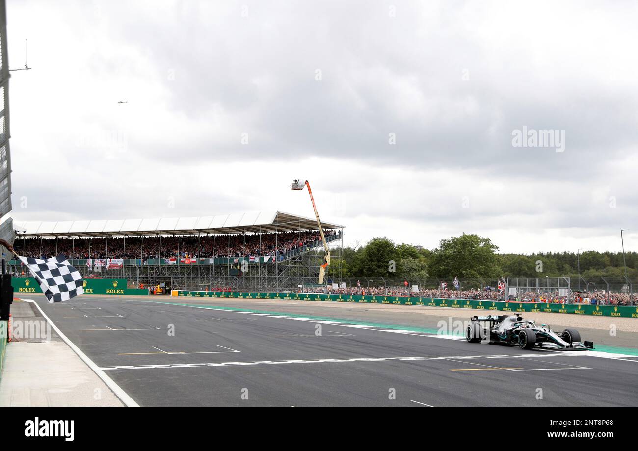 Mercedes driver Lewis Hamilton of Britain crosses the finish line to ...