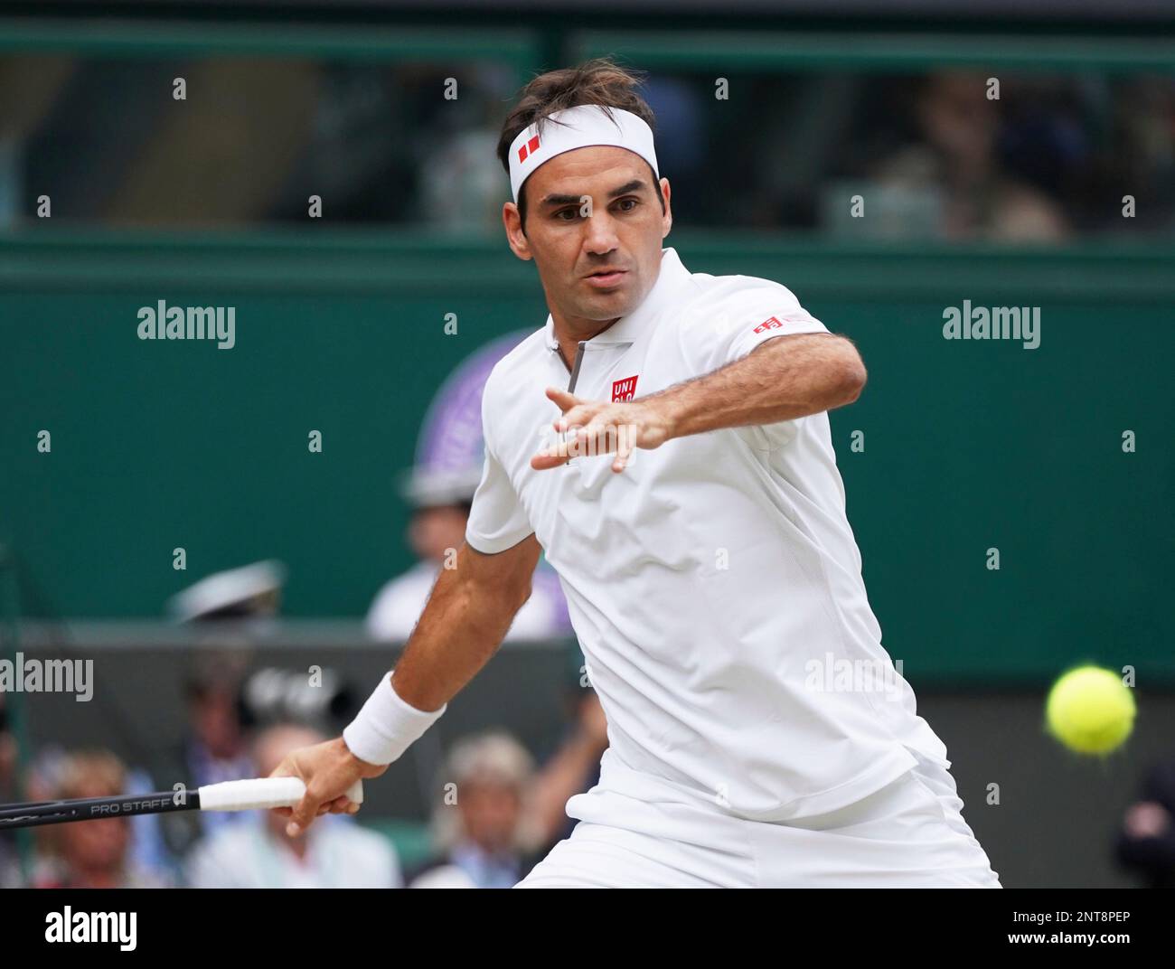 Roger Federer of Switzerland hits a ball during the Gentlemen's singles ...
