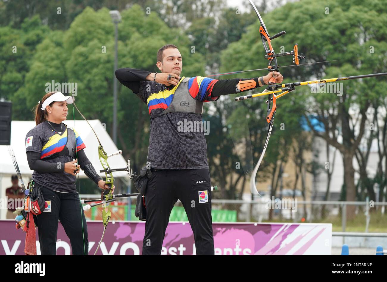 Ana Maria Rendon (F) and Daniel Felipe Pineda (M) of Colombia compete ...