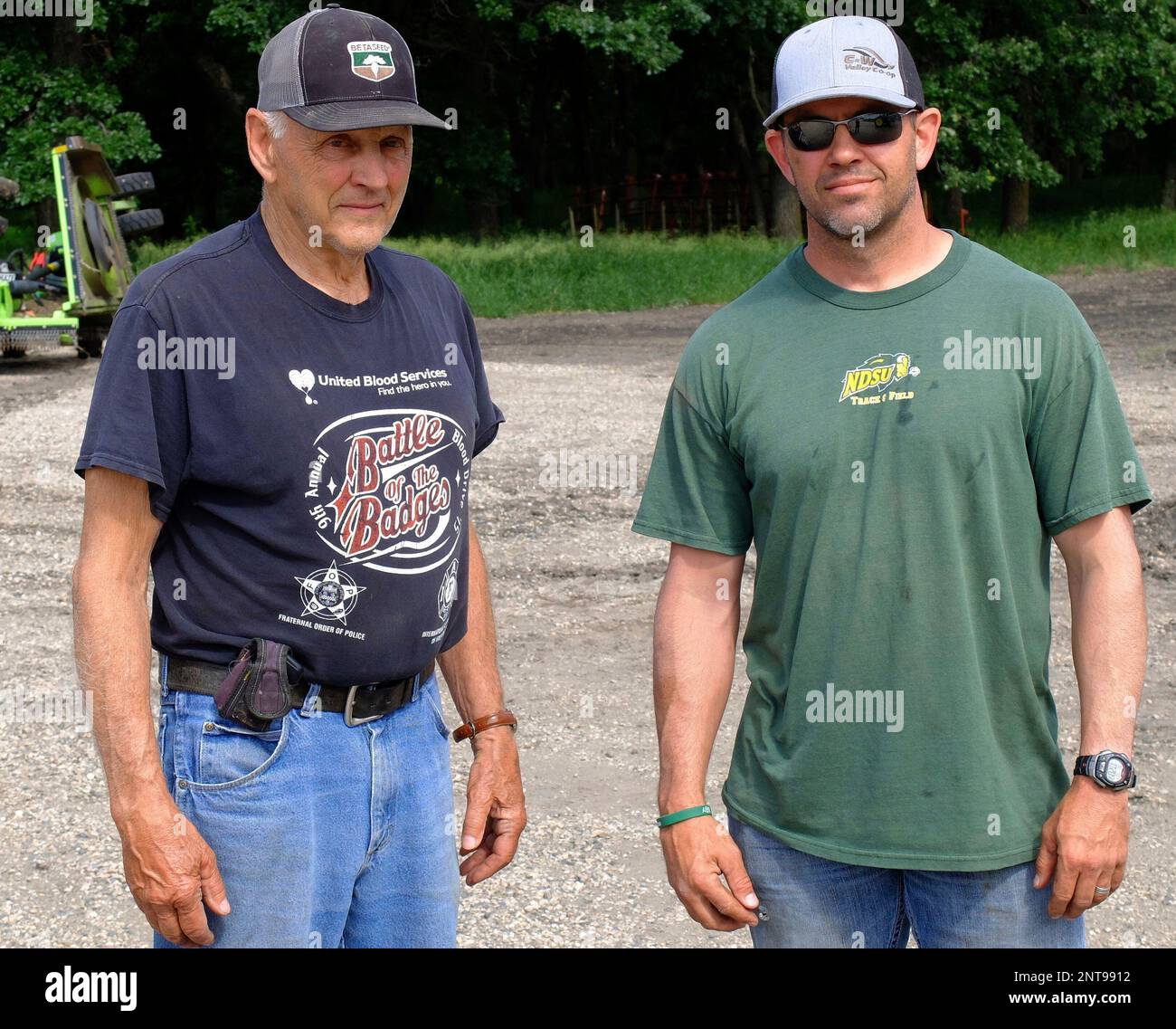 In this July 1, 2019, photo, Larry Ness, left, and his son Matt pose ...