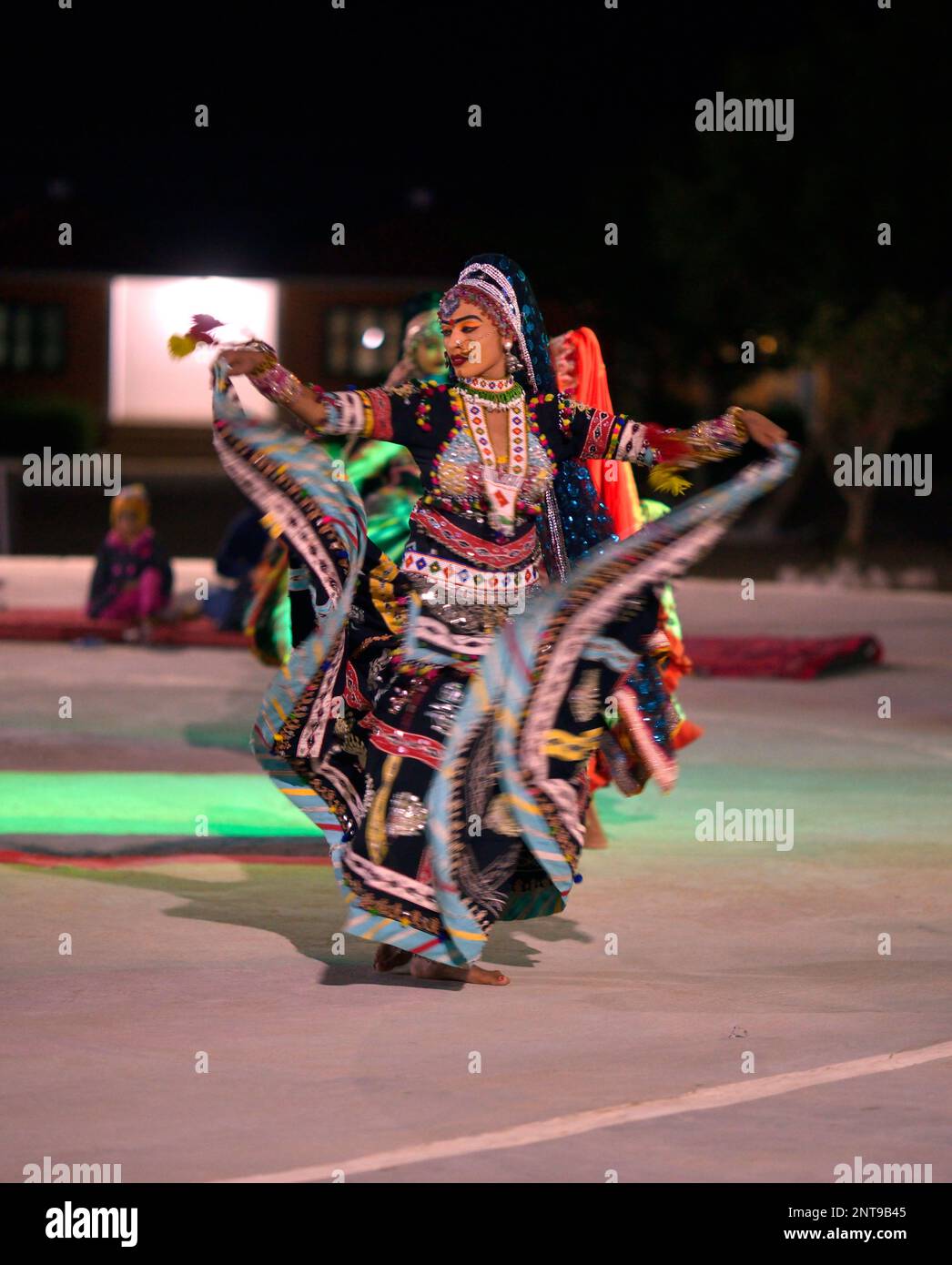 Women in colourful dress perform a traditional folk dance in the Thar ...