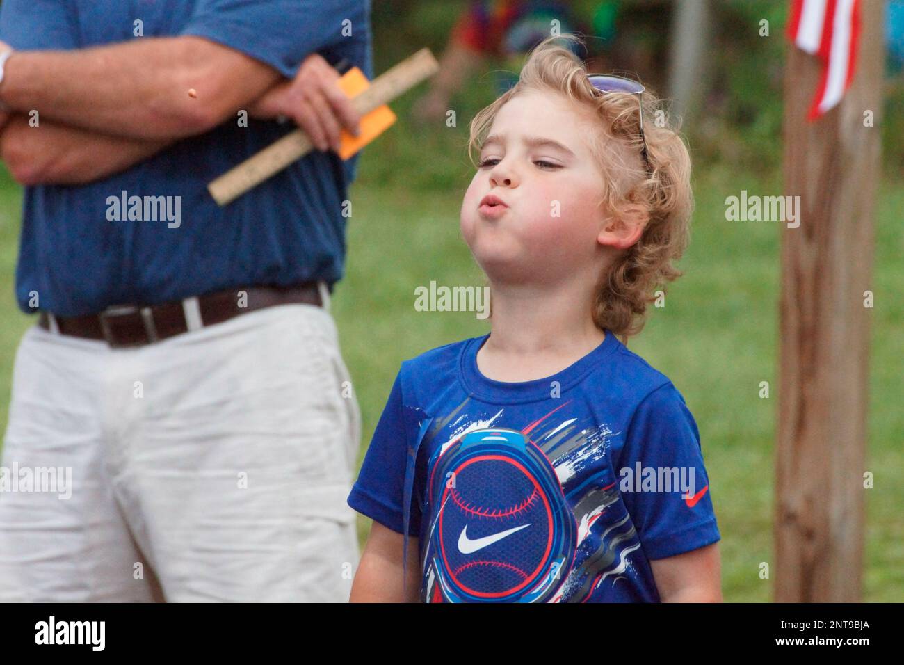 A participant spits at the 46th annual Cherry Pit-Spitting Championship ...