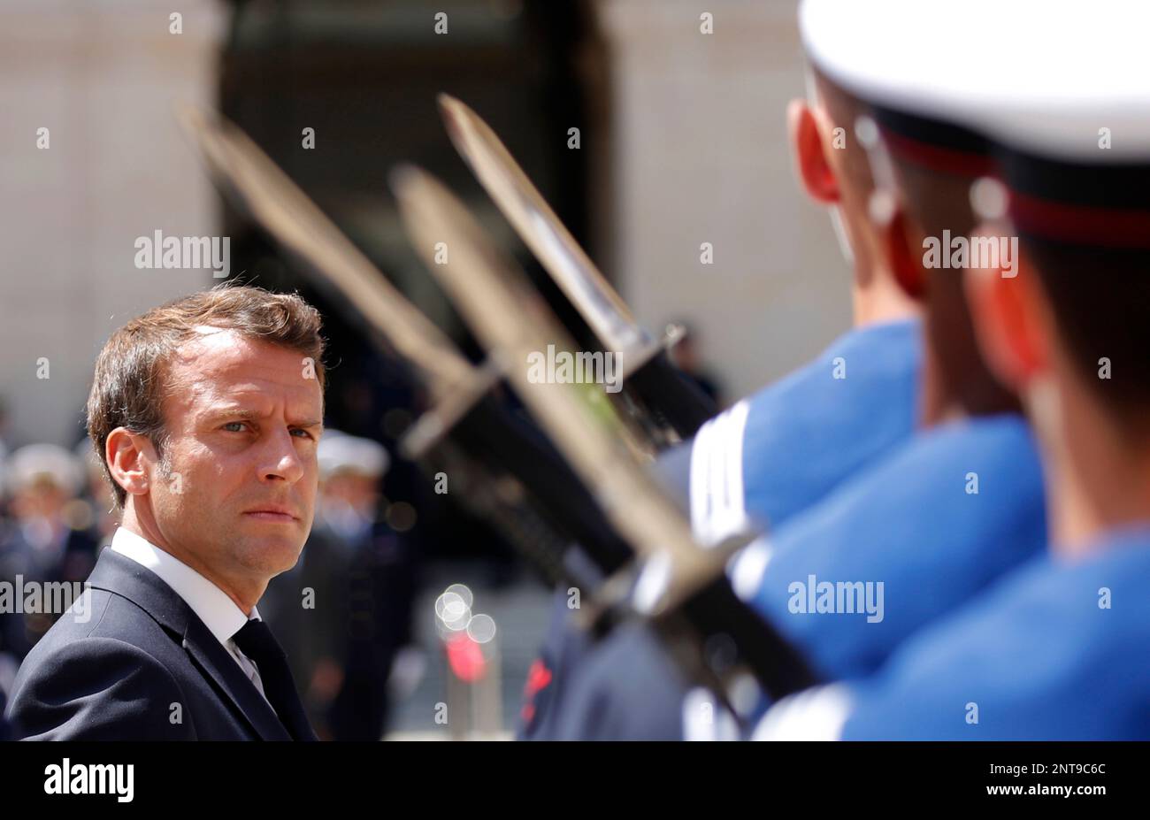 French President Emmanuel Macron reviews the honor guards during a ...