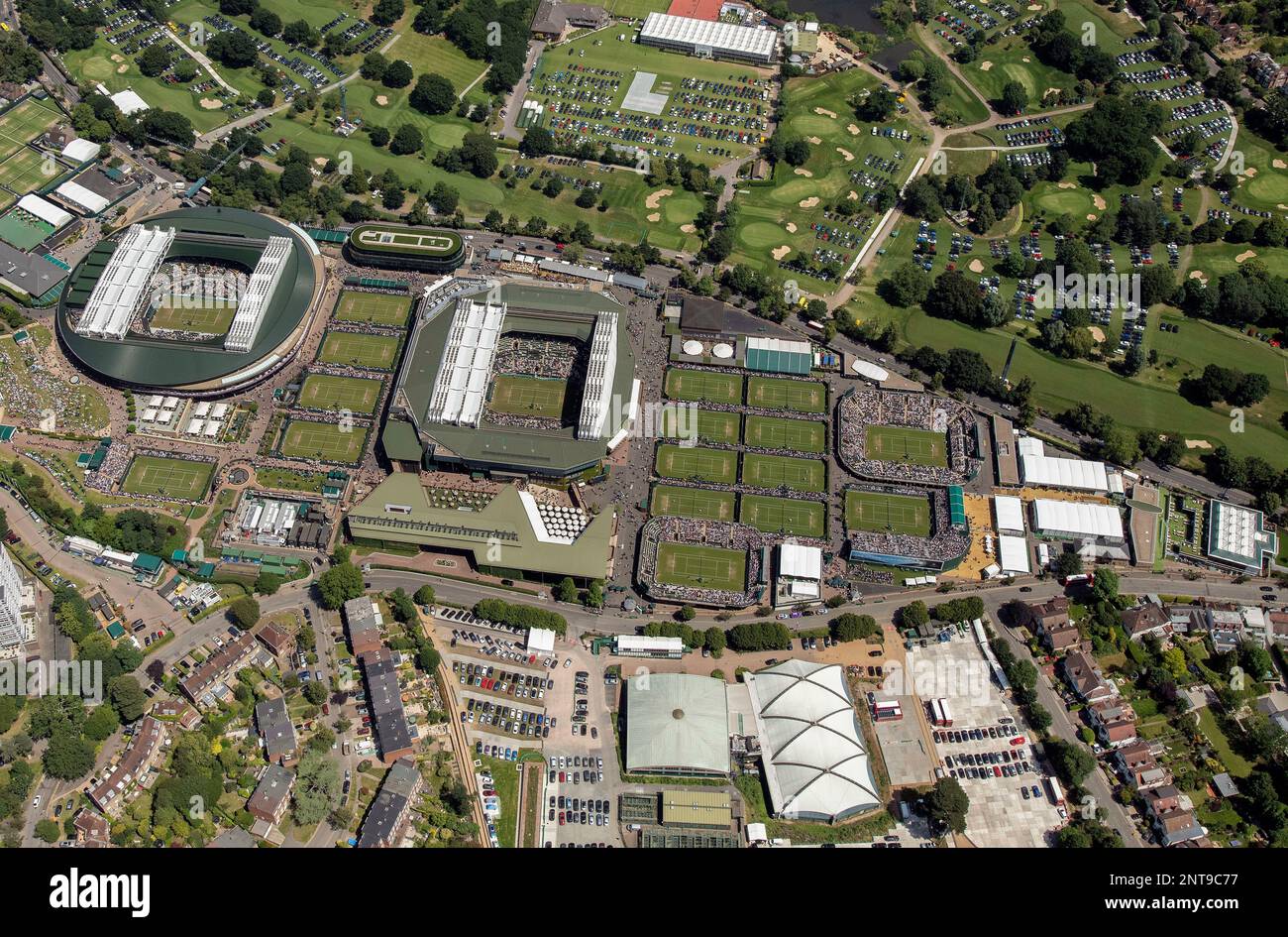 An aerial view of All England Tennis Club, bottom left, during day ...