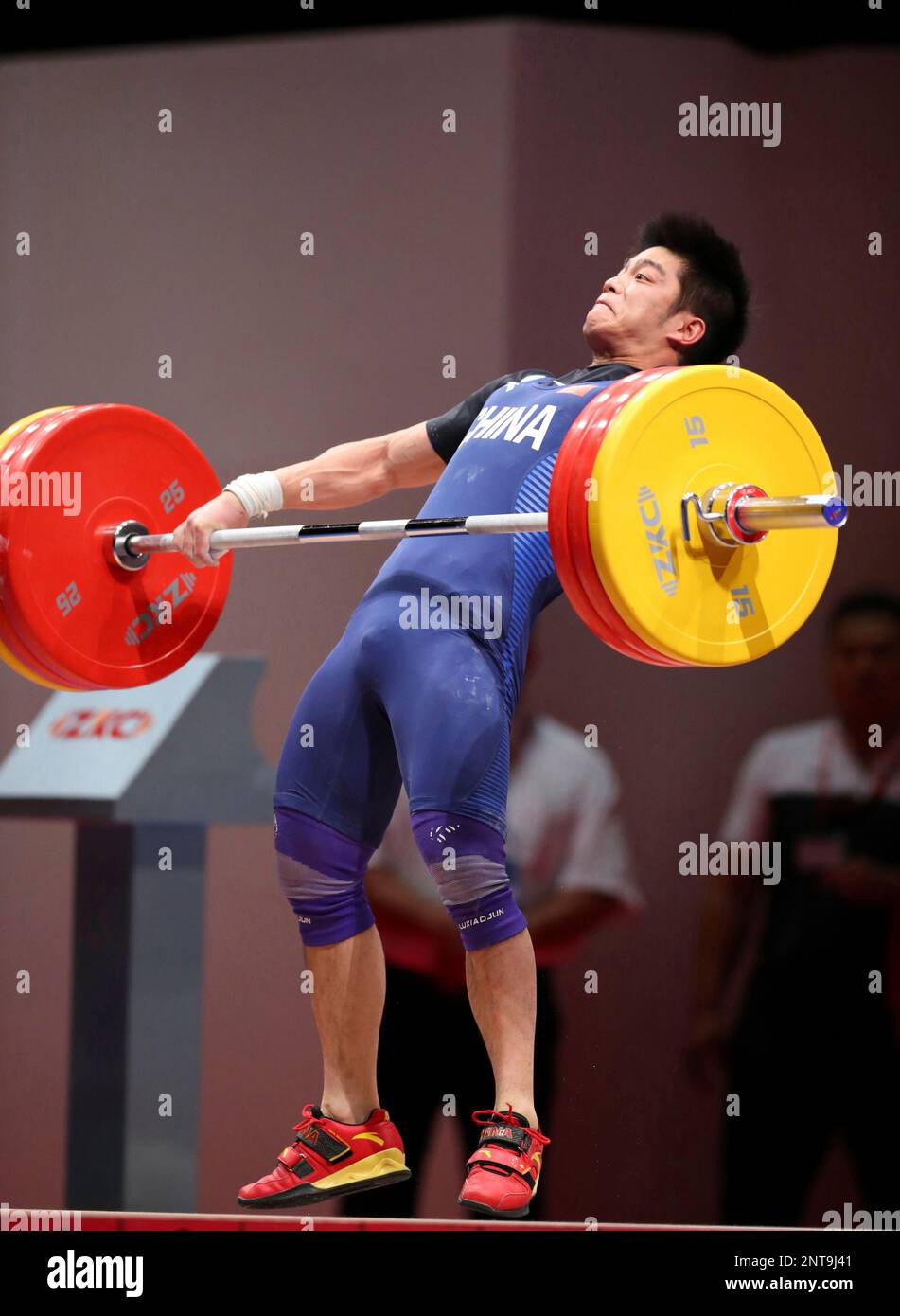 China's HUANG Minhao performs in Weightlifting Senior Men 67kg Snatch ...