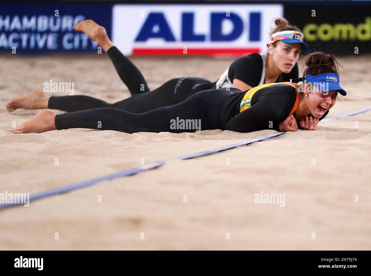 Australia's Mariafe Artacho lays in front of Switzerland's Nina ...