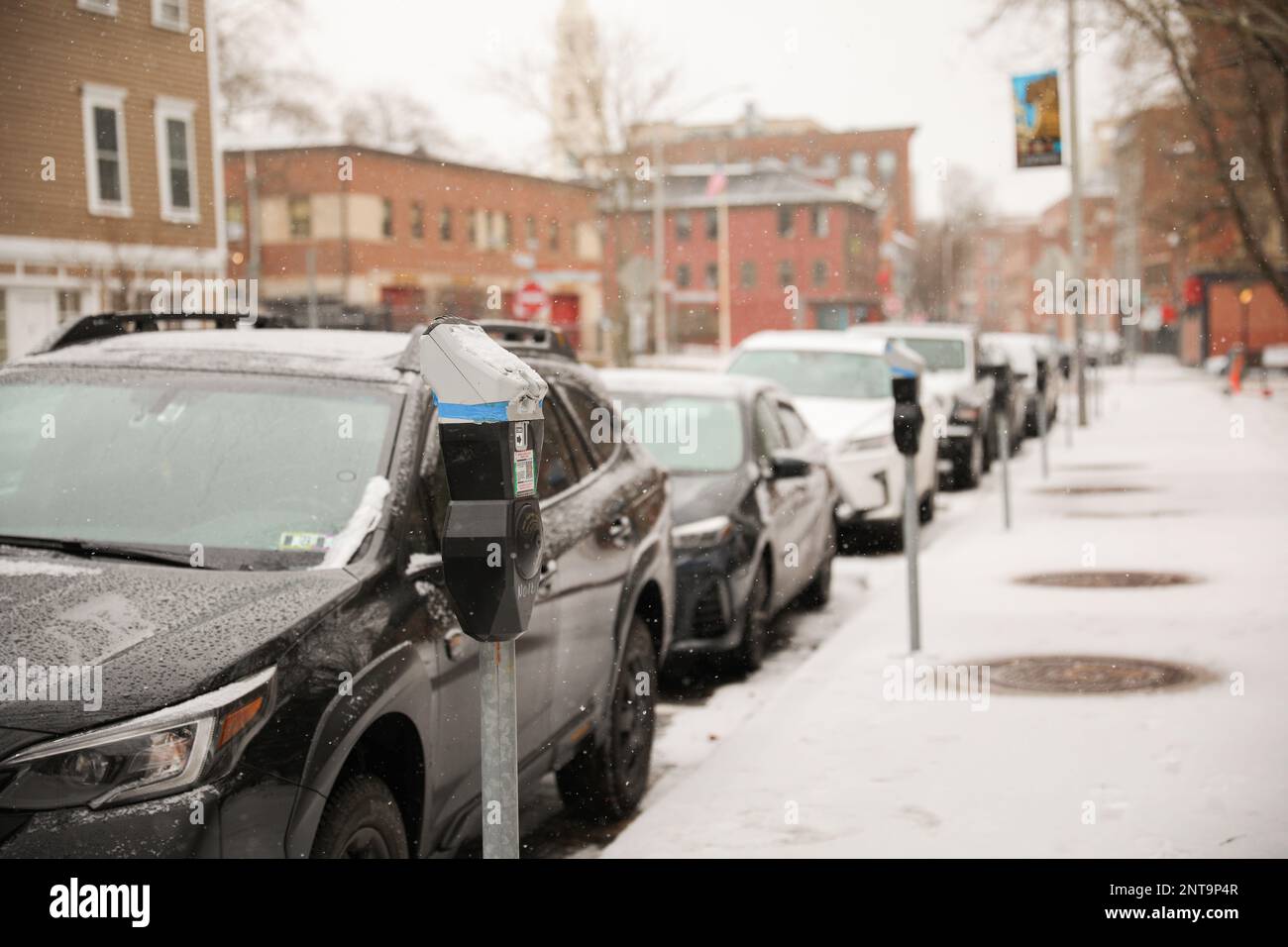 Snow on car during a cold snow storm in the city blizzard in the ...