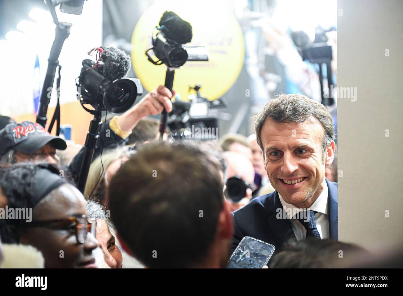 French President Emmanuel Macron from back speaks with journalists with ...