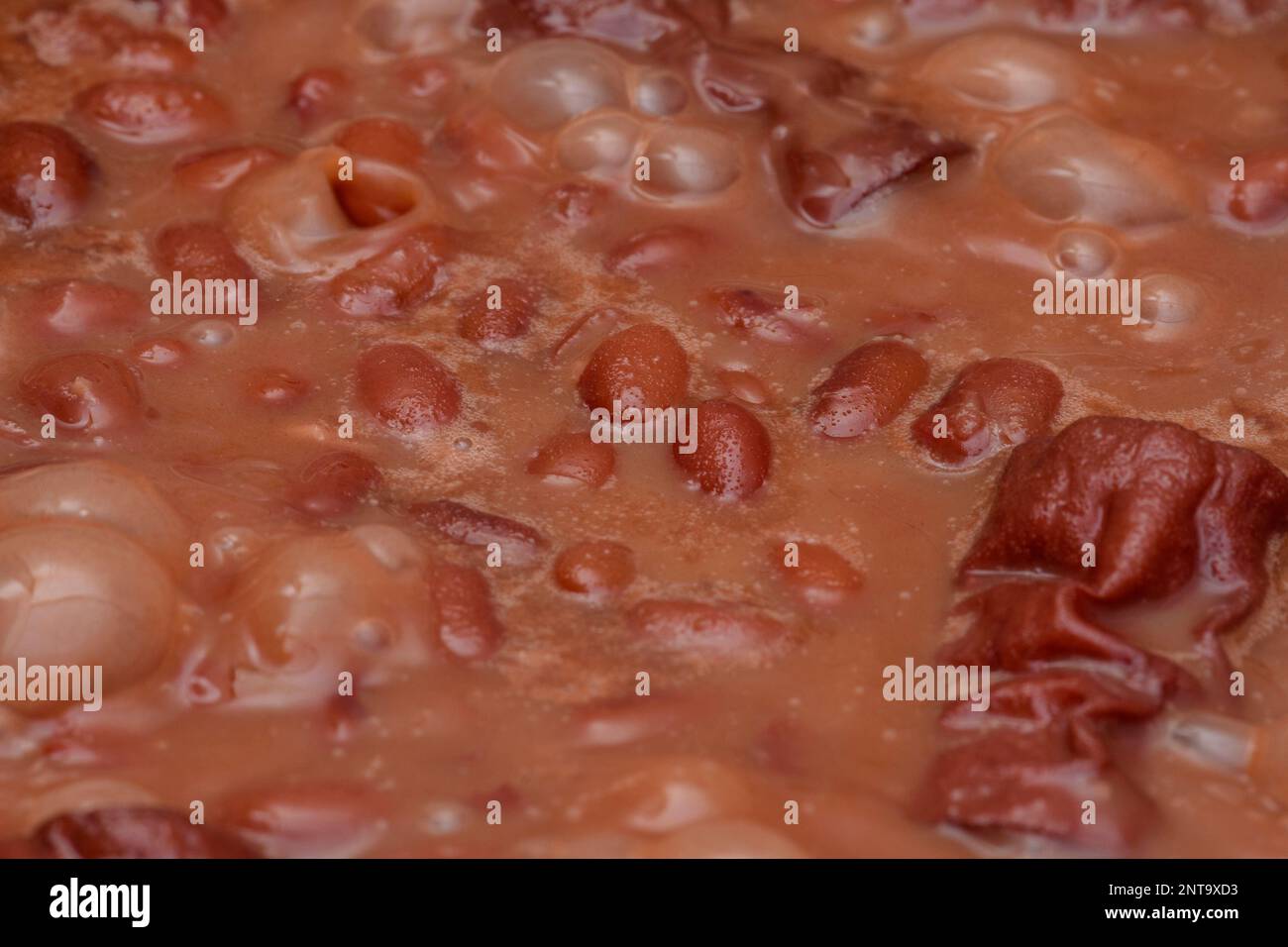 Brown brazilians beans being cooked showing details of the grains and ...