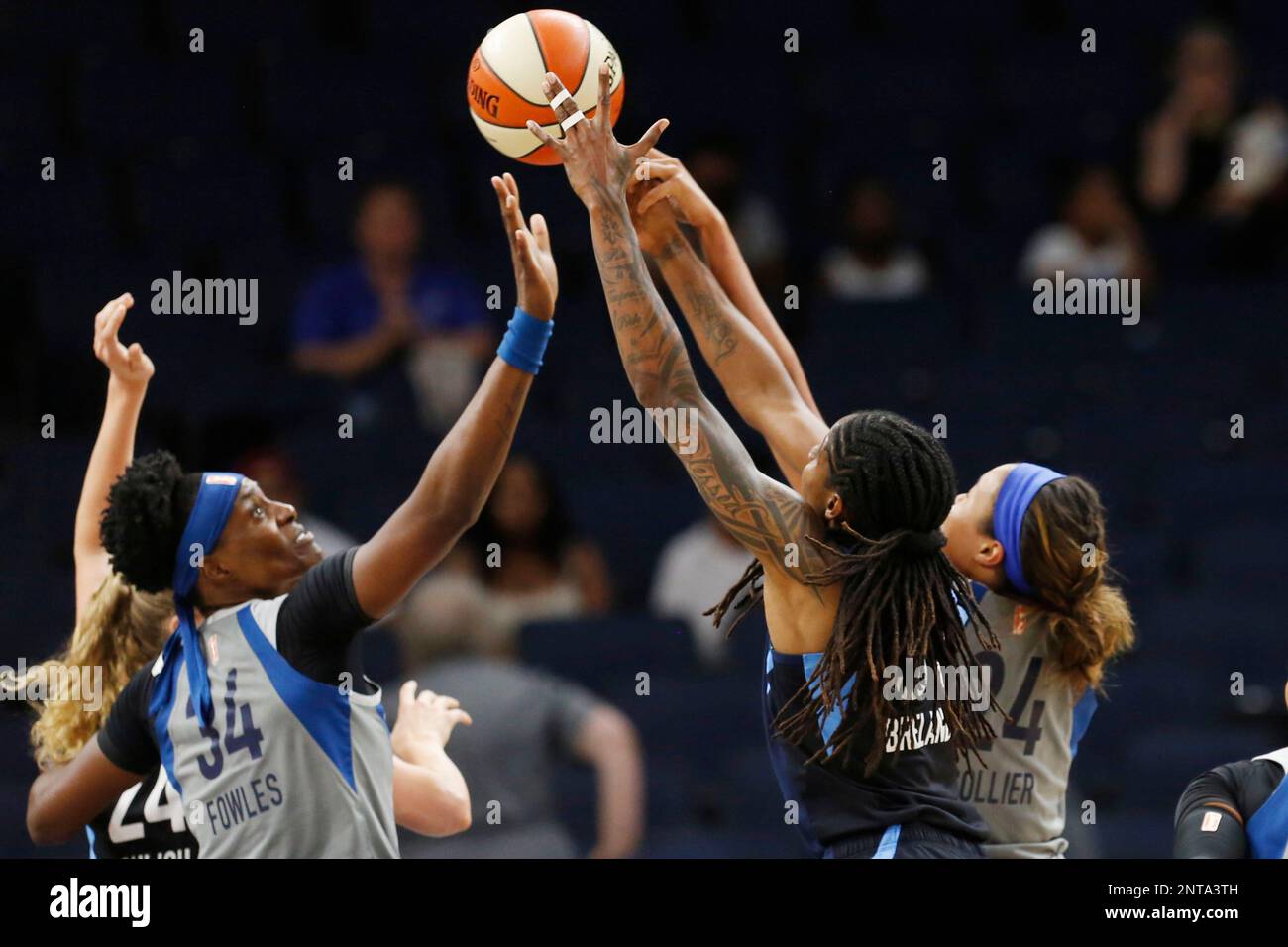 Atlanta Dream's Jessica Breland, middle, is defended by Minnesota Lynx ...