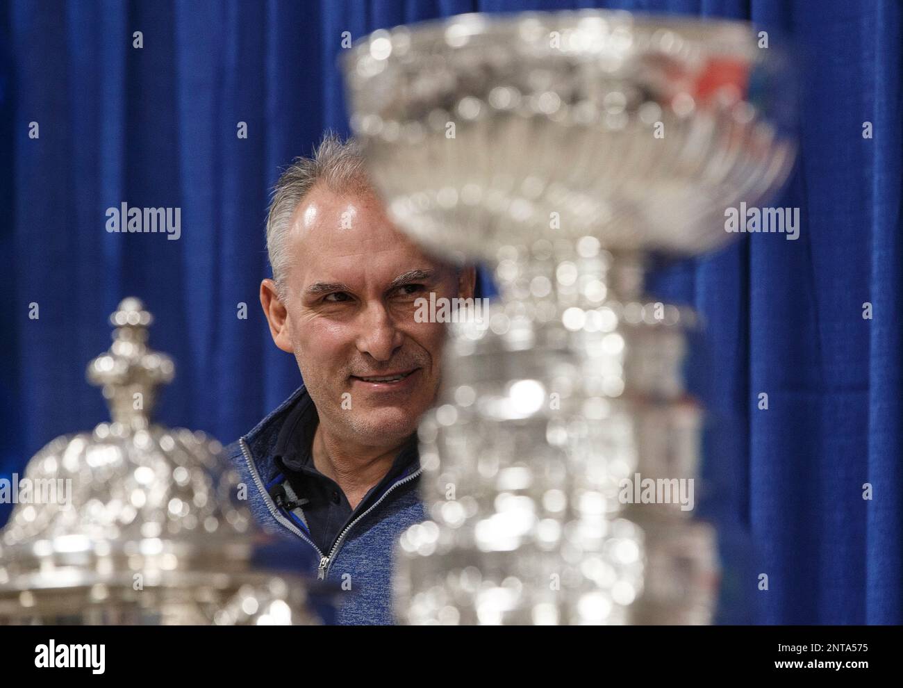 St. Louis Blues head coach Craig Berube poses with fans along with the ...