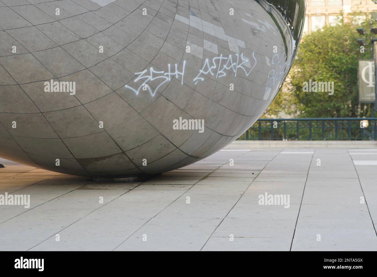 Graffiti mars the popular giant metallic sculpture known as "The Bean ...