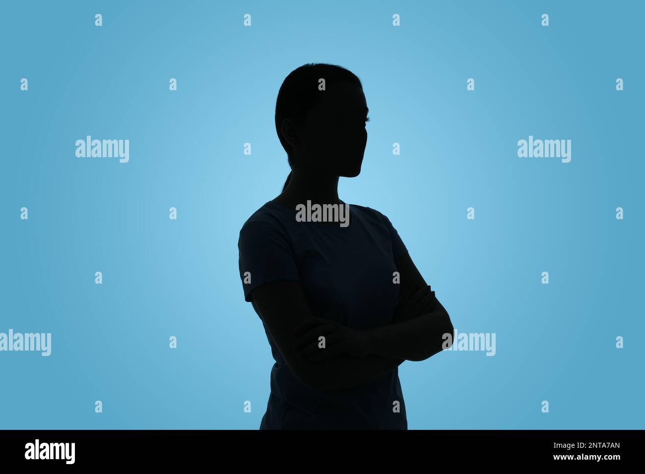 Silhouette of anonymous woman on light blue background Stock Photo - Alamy