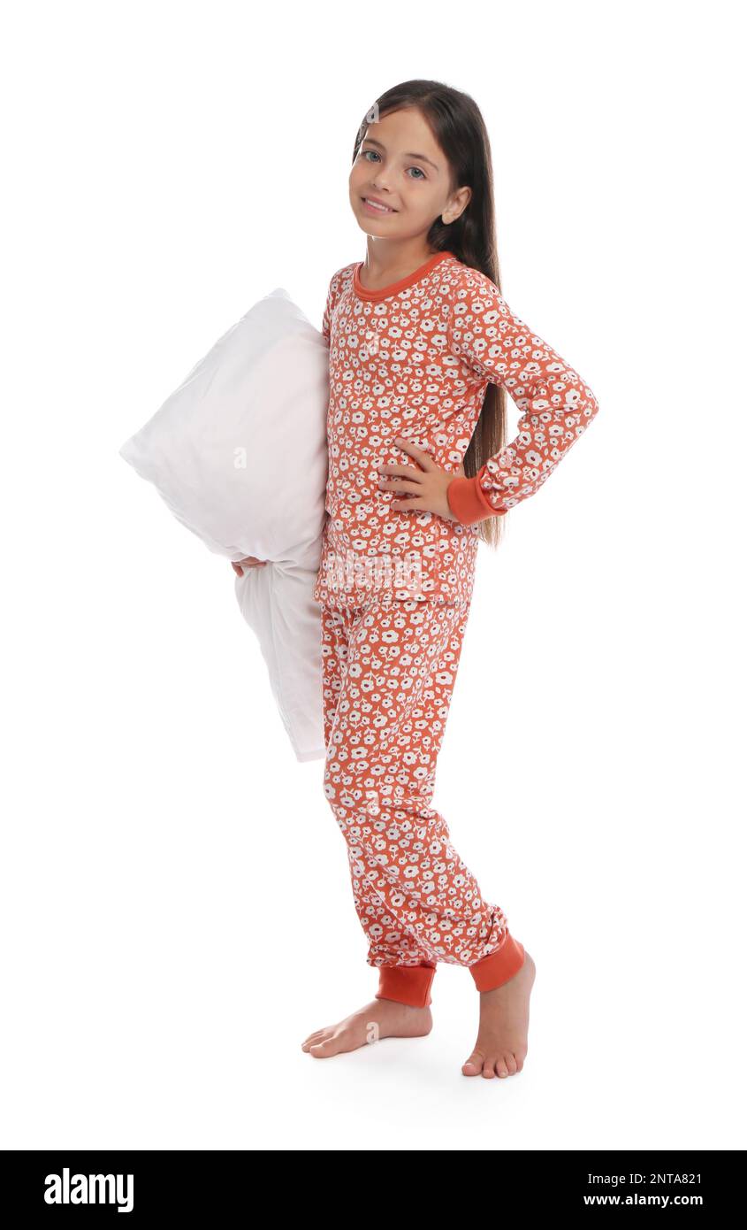 Cute girl wearing pajamas with pillow on white background Stock Photo ...