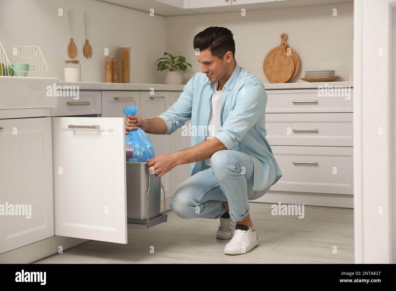Man taking out the trash hi-res stock photography and images - Alamy