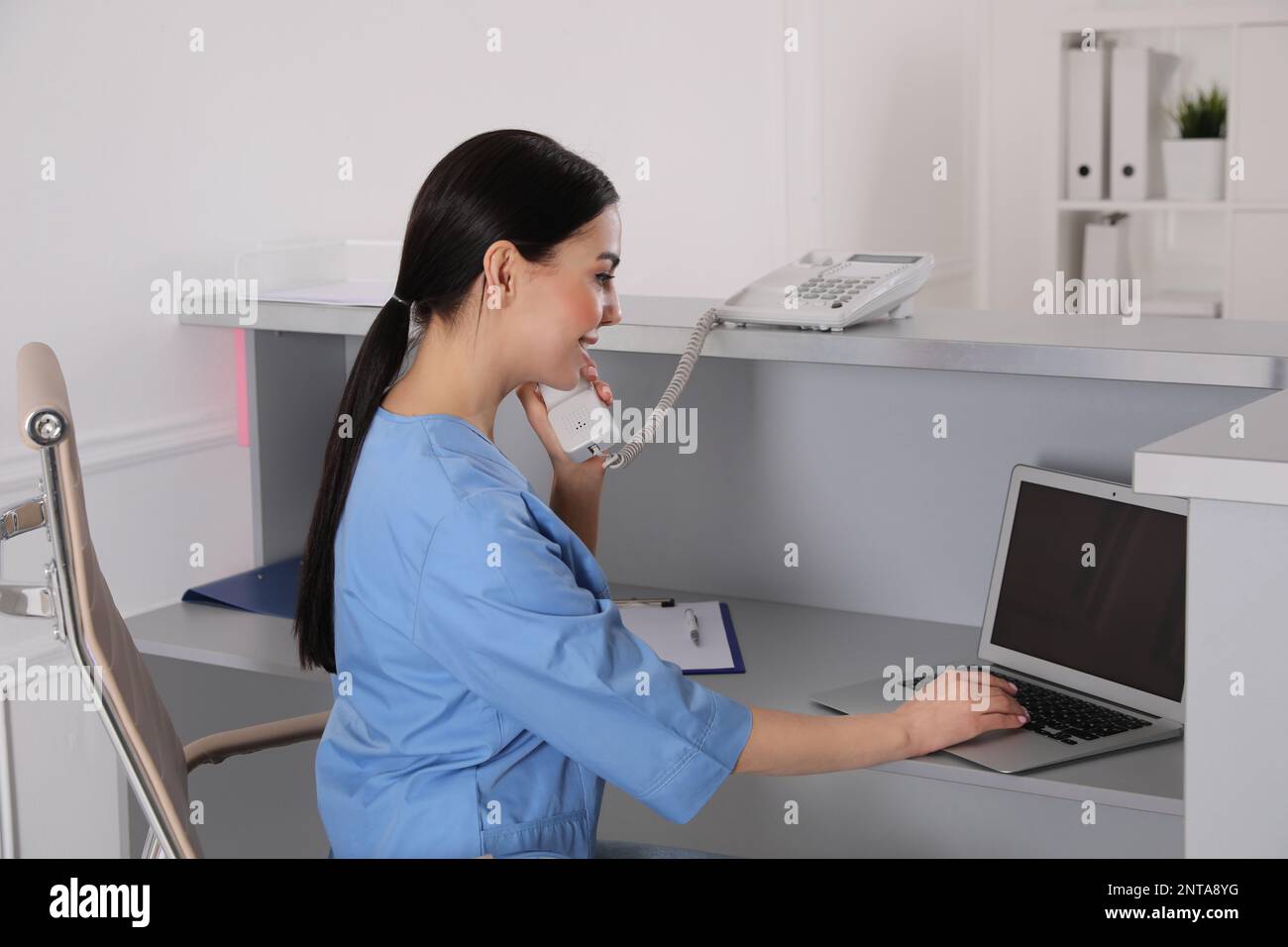 Medical receptionist phone hi-res stock photography and images - Alamy