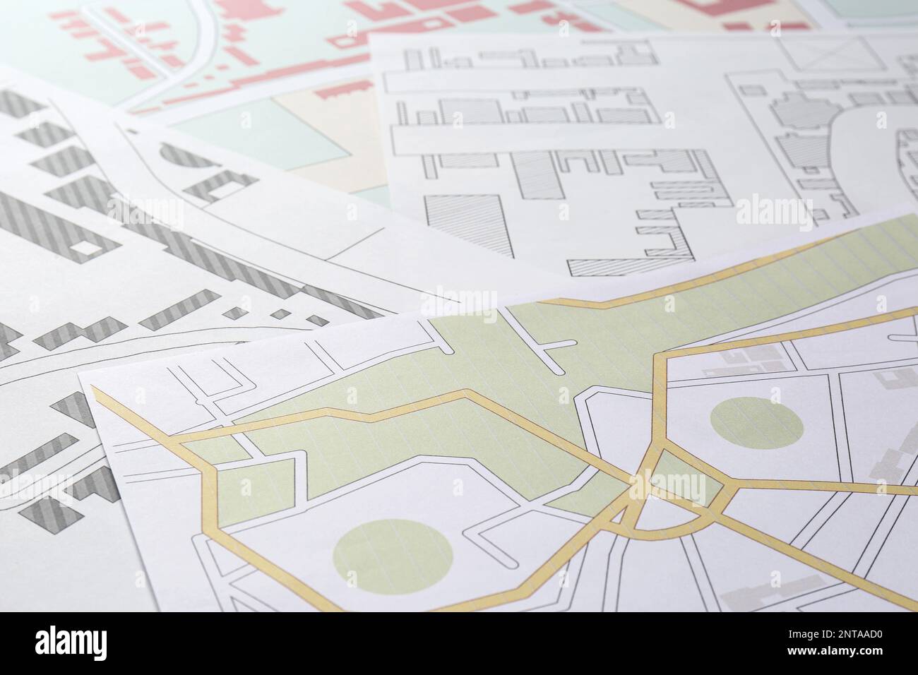 Many different cadastral maps of territory with buildings as background ...