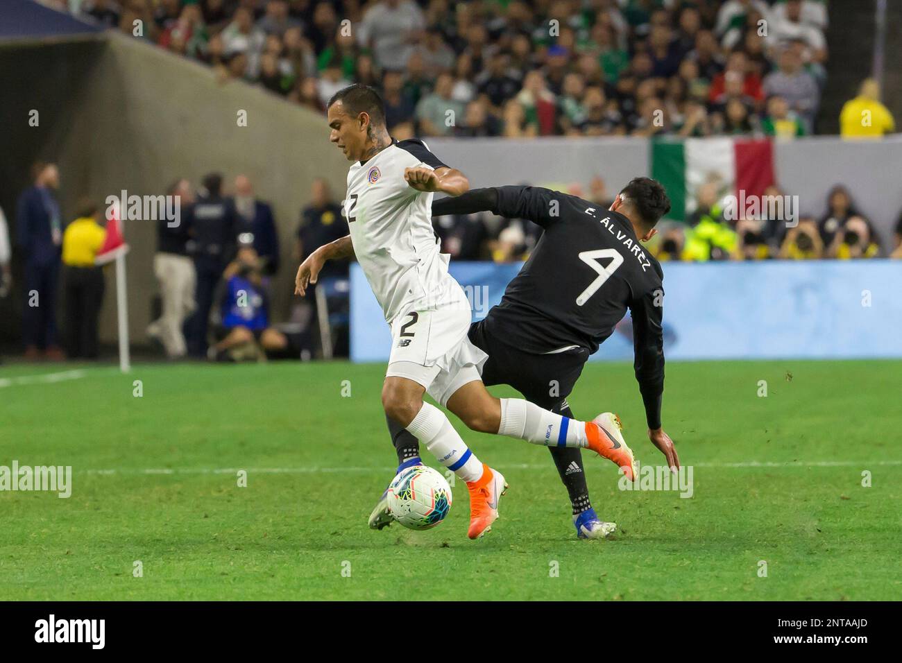 HOUSTON, TX - JUNE 29: Edson Alvarez (4) of Mexico pushes Randall Leal ...