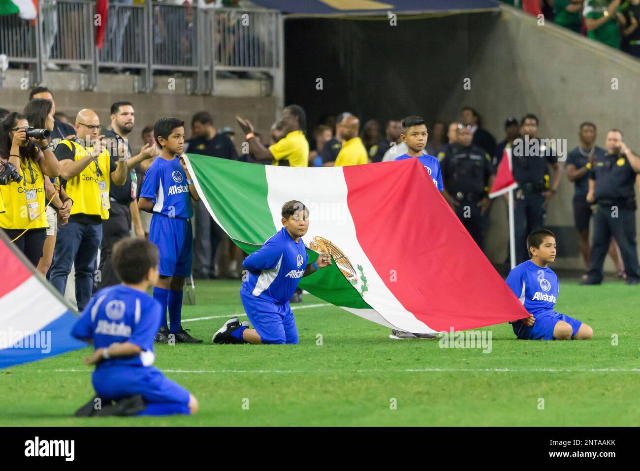 HOUSTON, TX - JUNE 29: children hold the Mexican flag during the ...