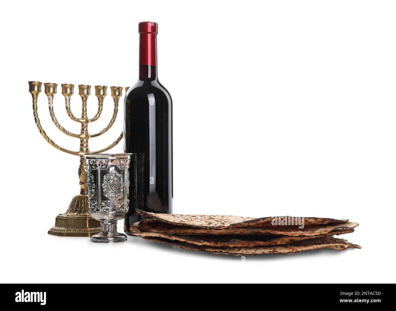 Tasty matzos, wine and menorah on white background. Passover (Pesach ...