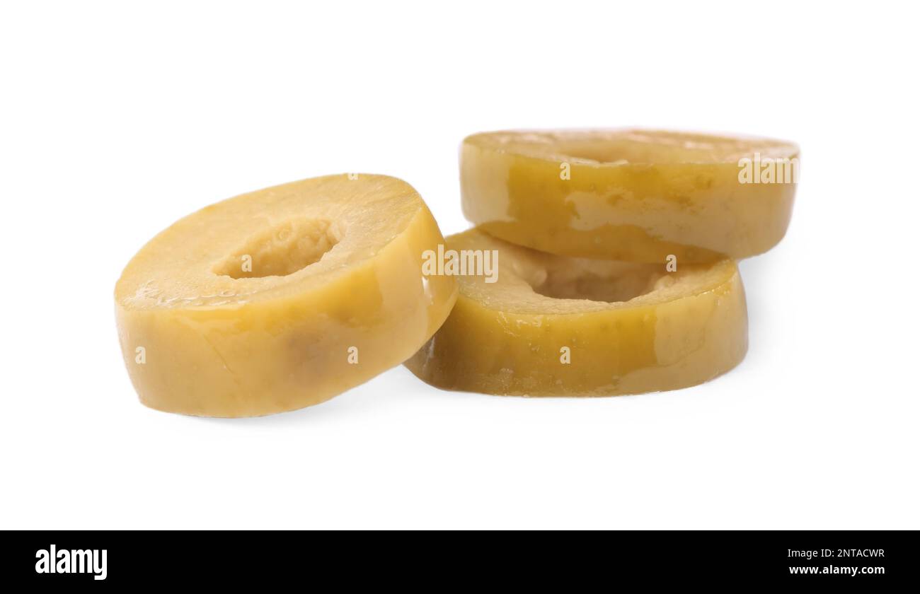 Cut fresh green olives on white background Stock Photo - Alamy