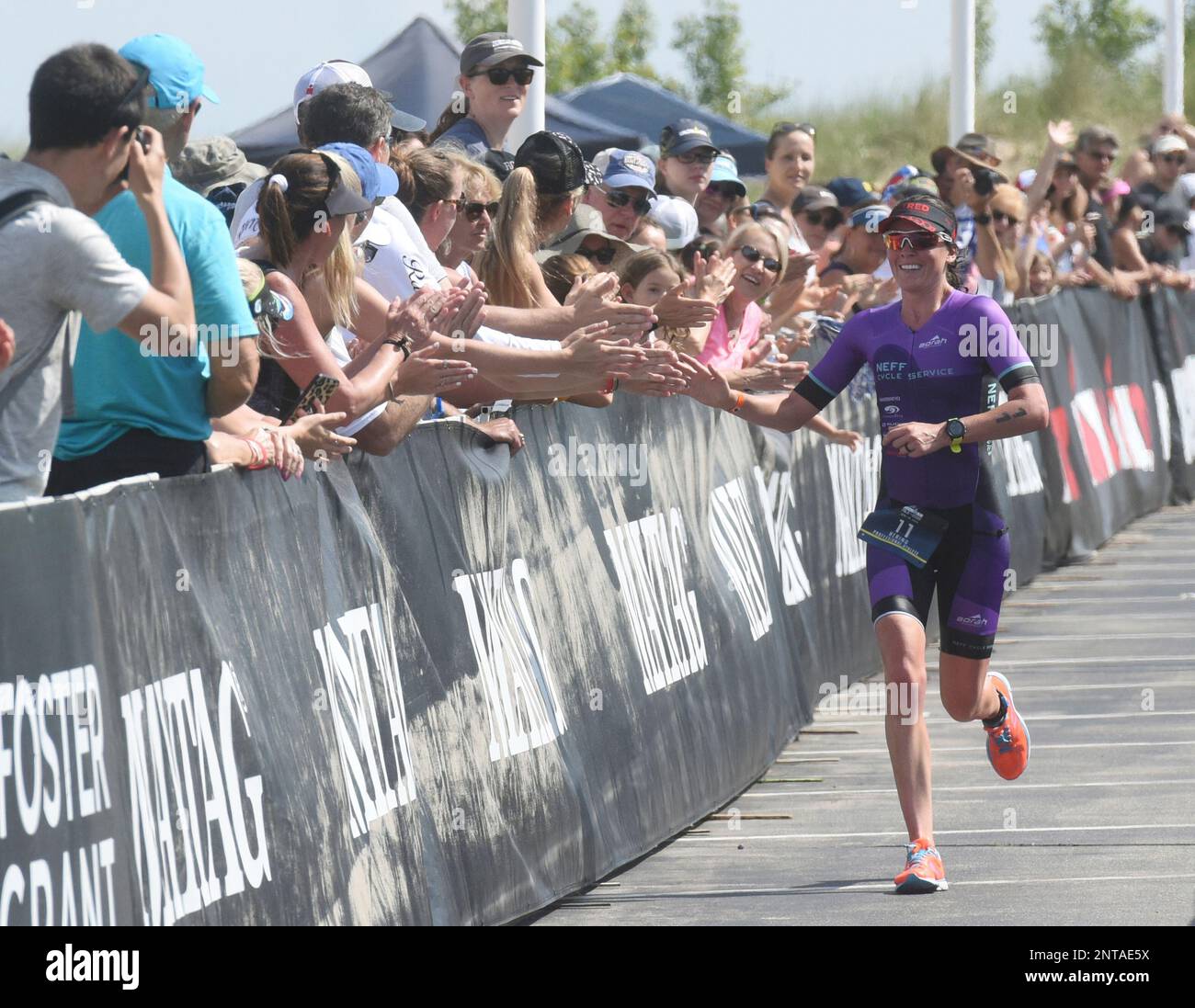 Jackie Hering heads to the finish line to win the women's pro division ...