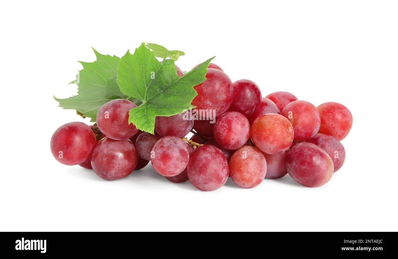 Cluster of ripe red grapes with green leaves on white background Stock Photo - Alamy