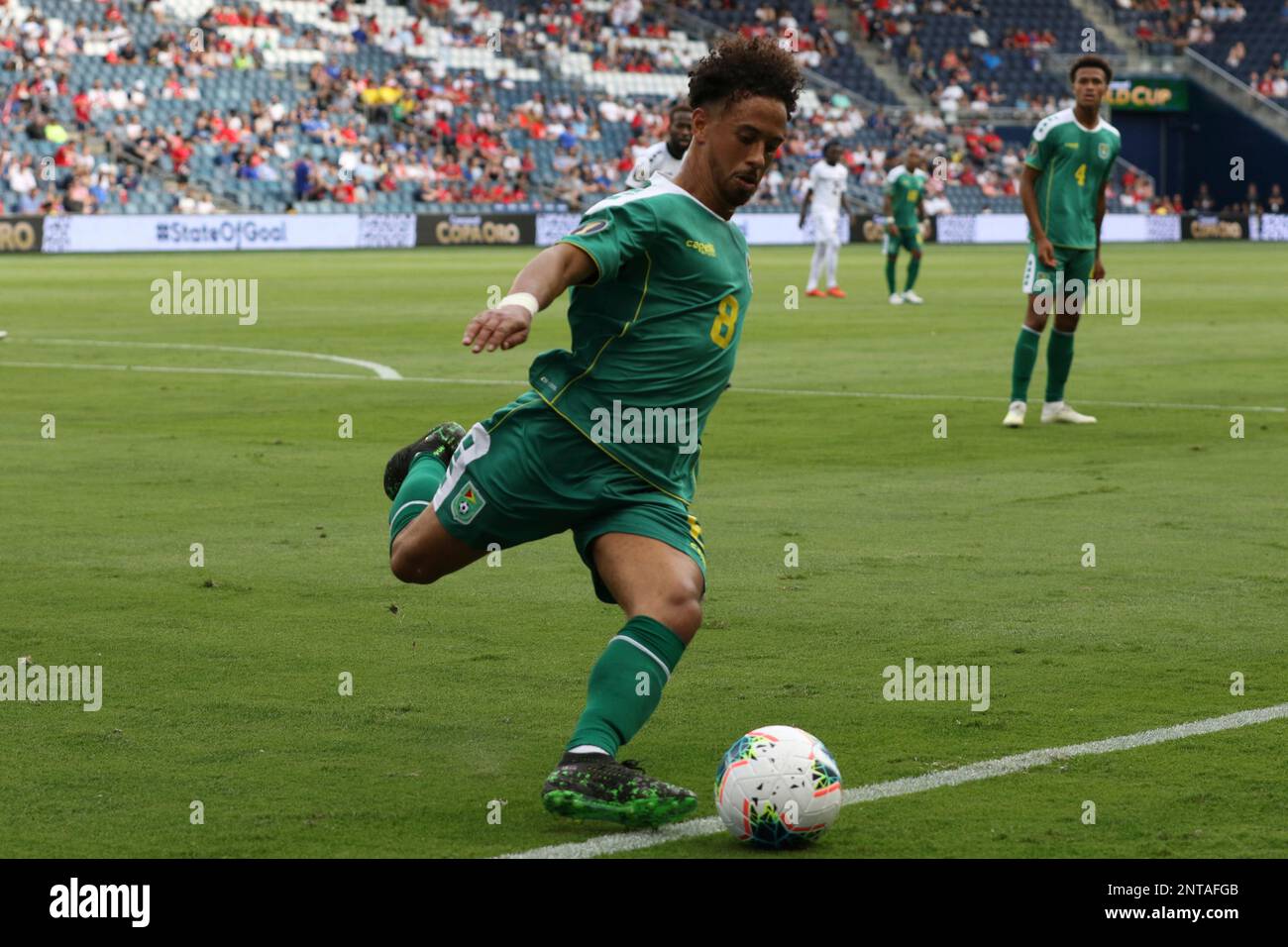 KANSAS CITY, KS - JUNE 26: Guyana defender Samuel Cox (8) clears a ball ...