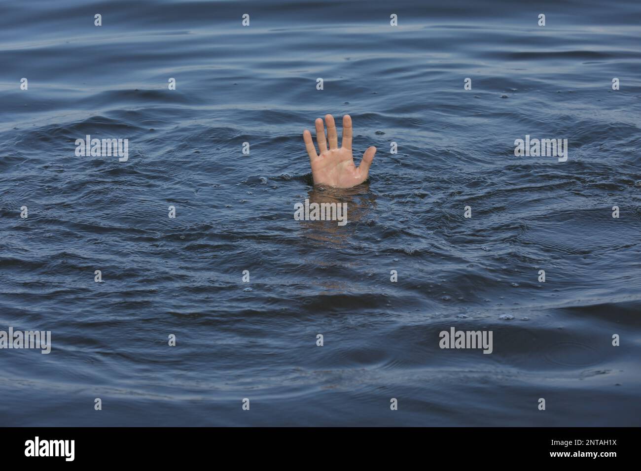 Drowning man reaching for help in sea, closeup Stock Photo - Alamy