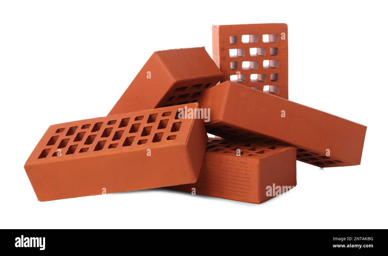 Many red bricks on white background. Building material Stock Photo - Alamy