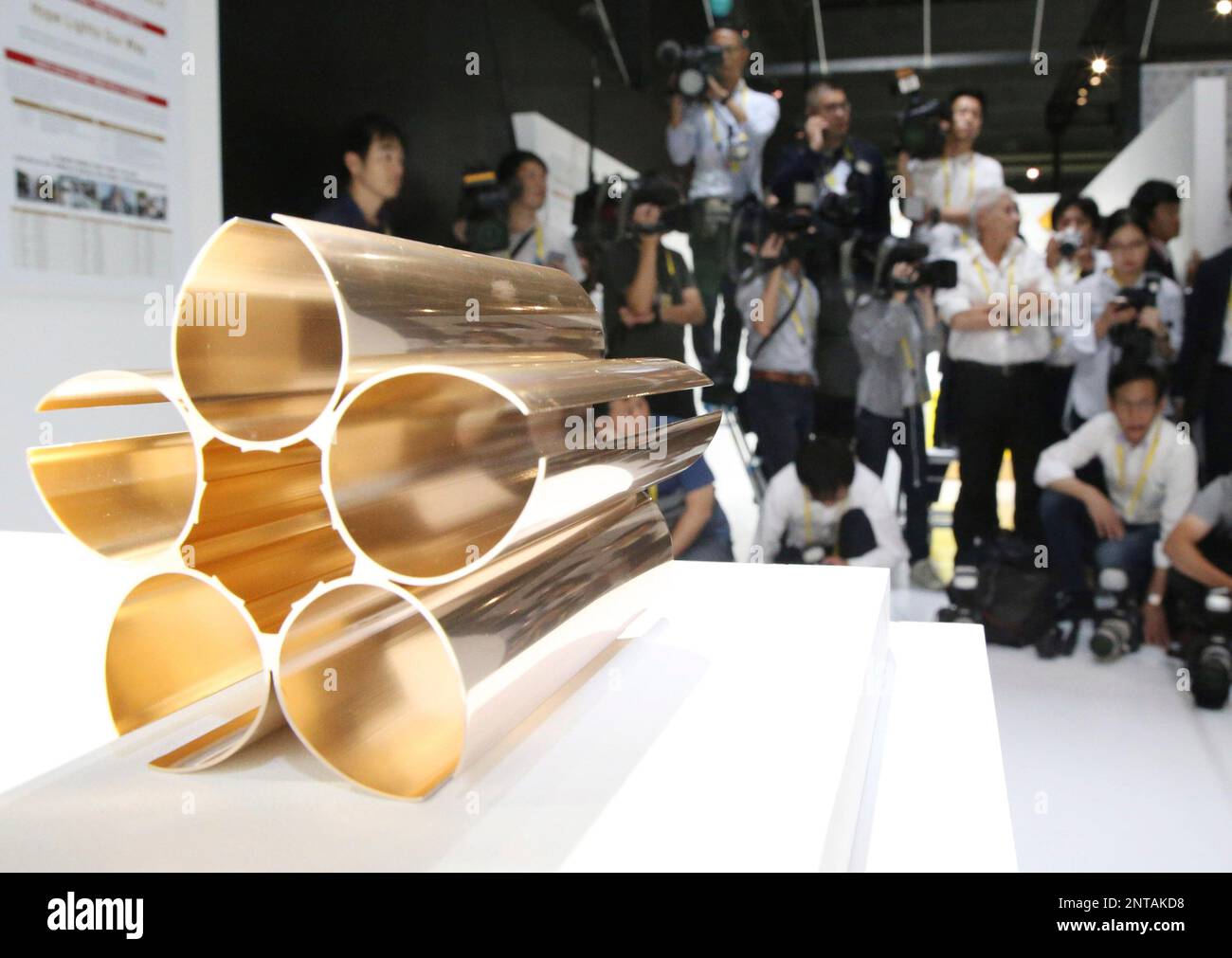 A torch for Tokyo Olympics is displayed at a promotion booth of Tokyo ...