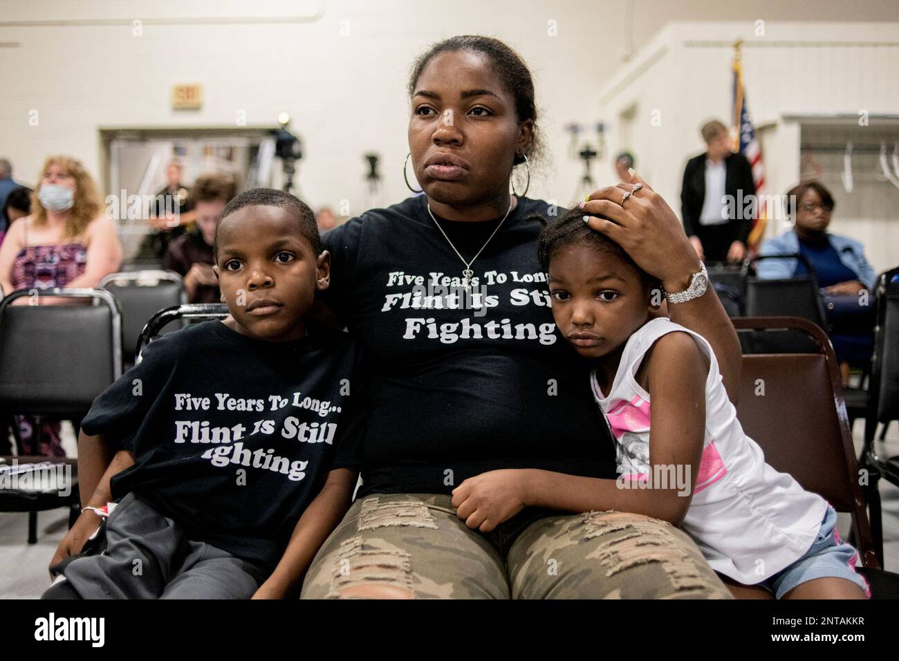 Flint resident Ariana Hawk consoles her son Sincere Smith, left, and ...