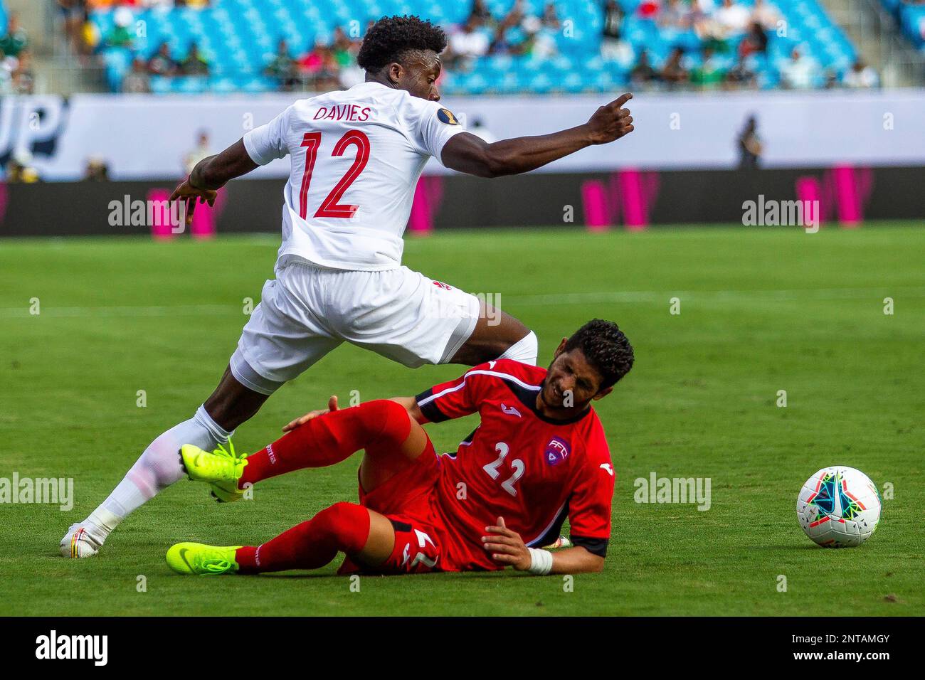 June 23, 2019: Cuba midfielder Roberney Caballero (22) gets twisted up ...