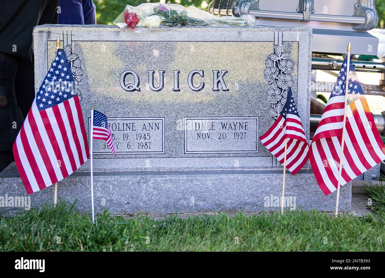American Flags adorn the headstone of Dale Quick, a Korean War veteran ...