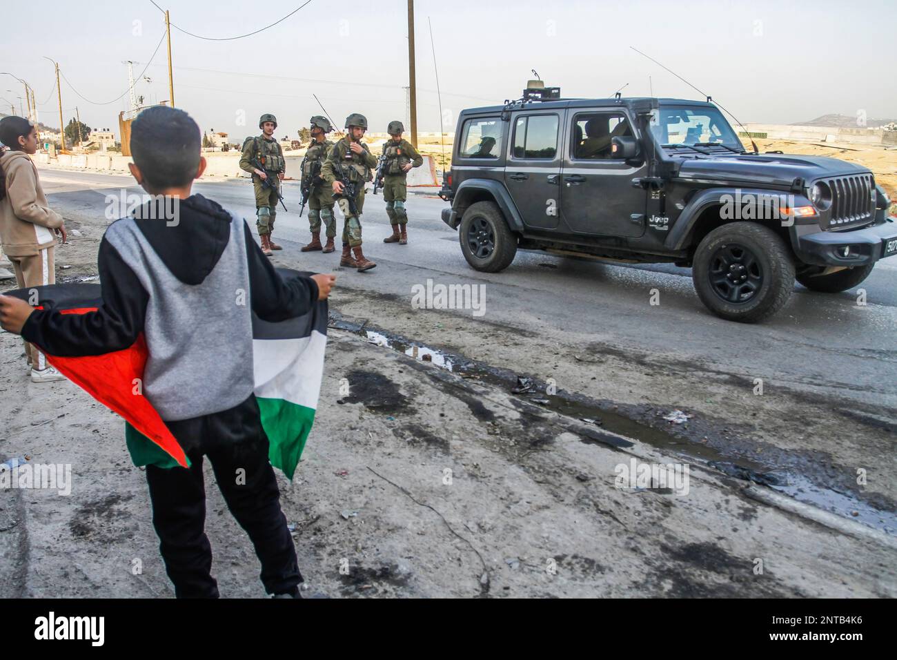Nablus, Palestine. 27th Feb, 2023. A Palestinian child confronts ...