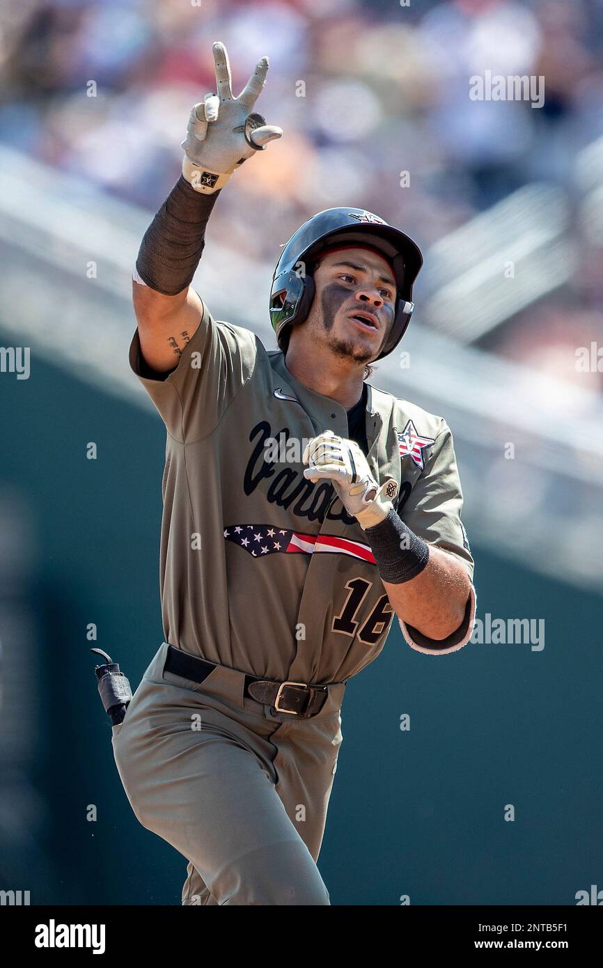 Vanderbilt Commodores third baseman Austin Martin (16) flashes the VU ...