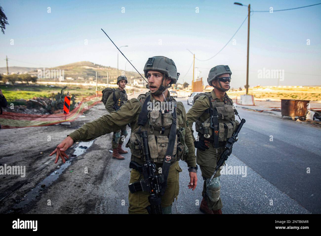 Nablus, Palestine. 27th Feb, 2023. Israeli soldiers separate the Jewish ...