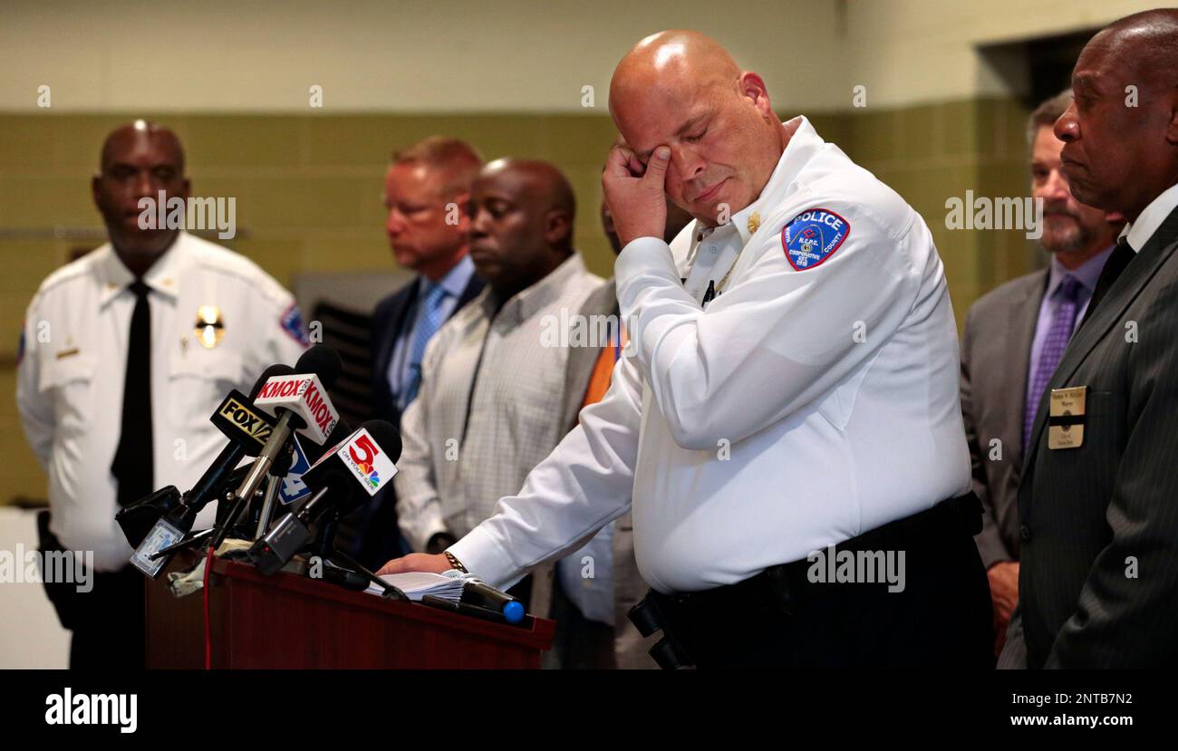 Assistant Police Chief Ron Martin addresses the media with support from ...