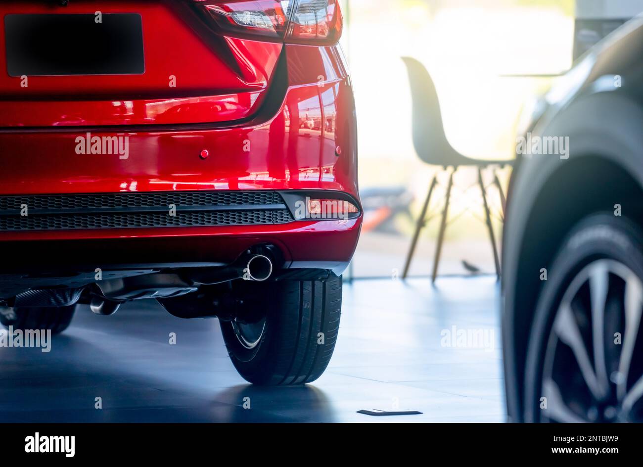 Rearview car parked in luxury showroom. Car dealership office. New car ...