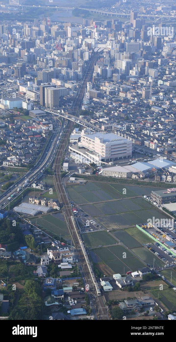 An aerial photo shows an electric train on the Odakyu Odawara line ...