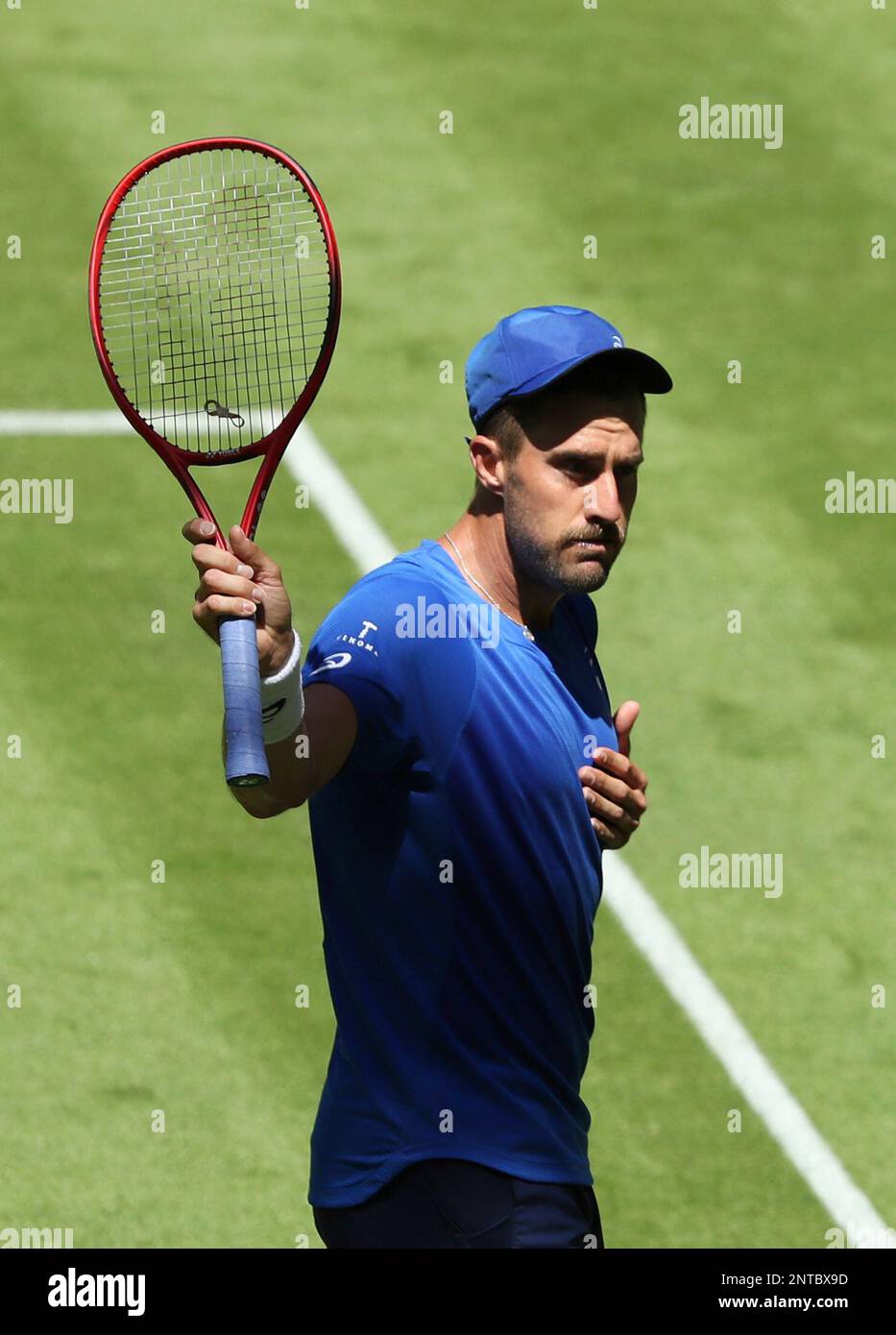 Steve Johnson from United States shows his racket after he defeated ...