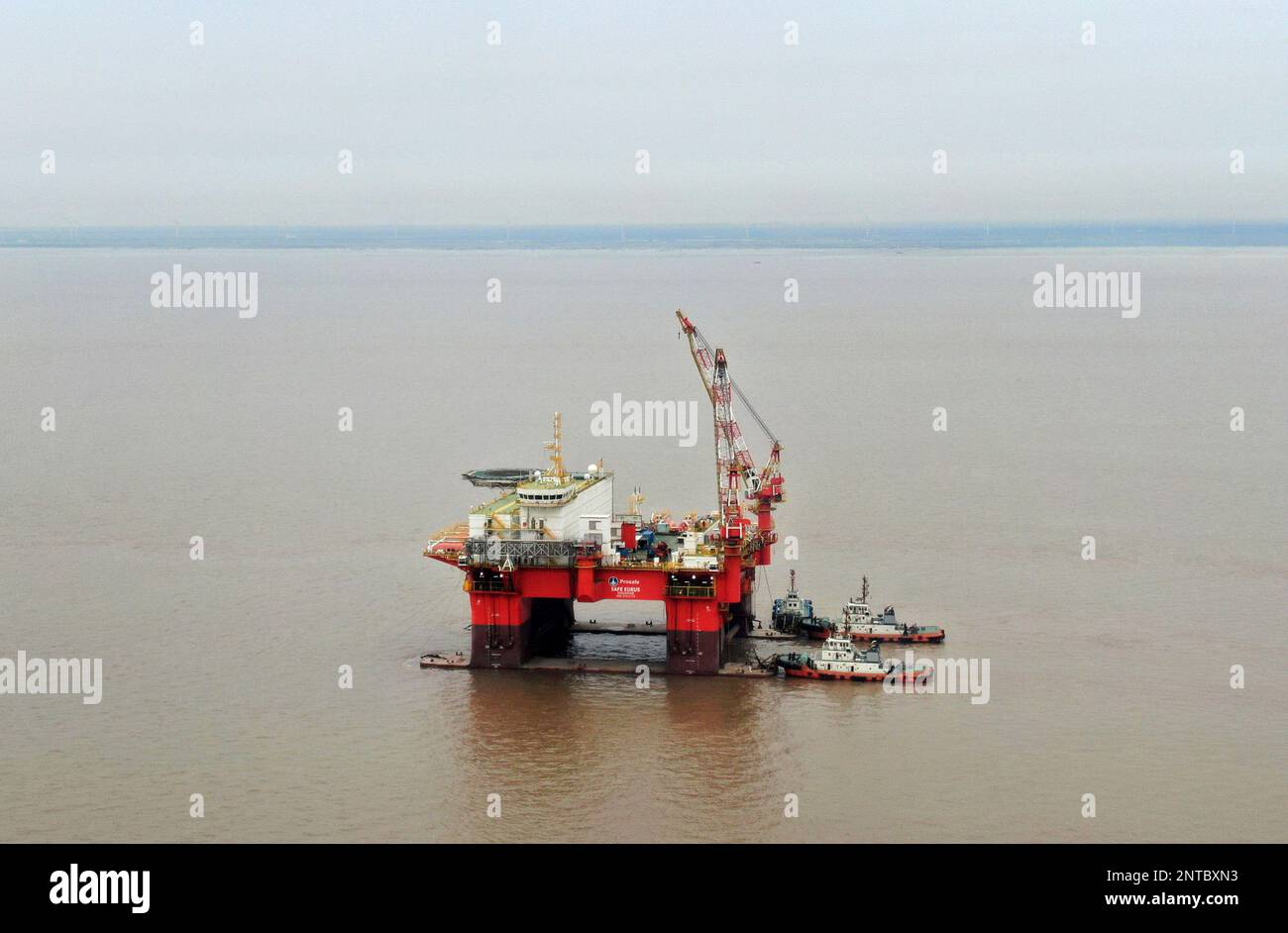 Tugboats move a semi-submersible platform of accommodations built by a ...