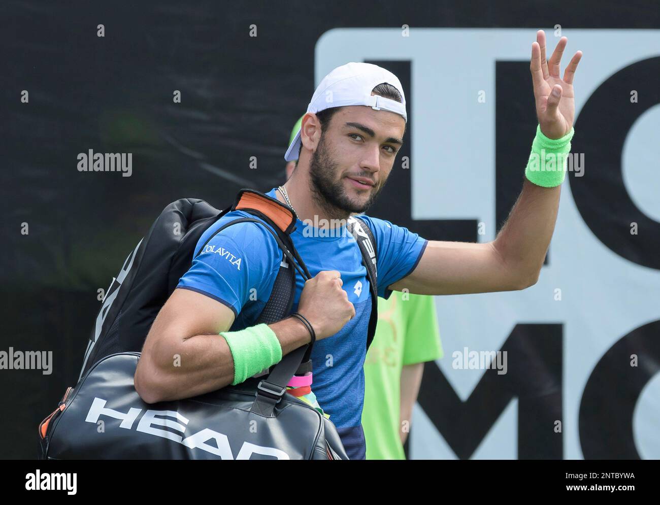 Italy's Matteo Berrettini waves as he arrives the court for his final match against Canada's ...