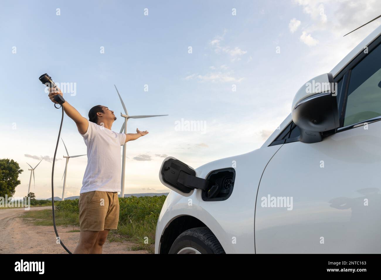 Progressive man spread arm with electric car recharge energy from ...