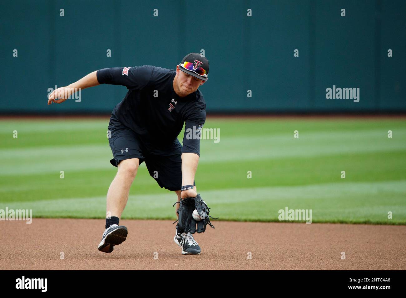 Texas Tech's Brian Klein fields a ground ball while taking morning ...