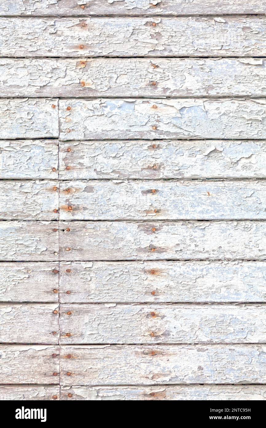 Close-up on an old white painted wooden board background with rusty ...